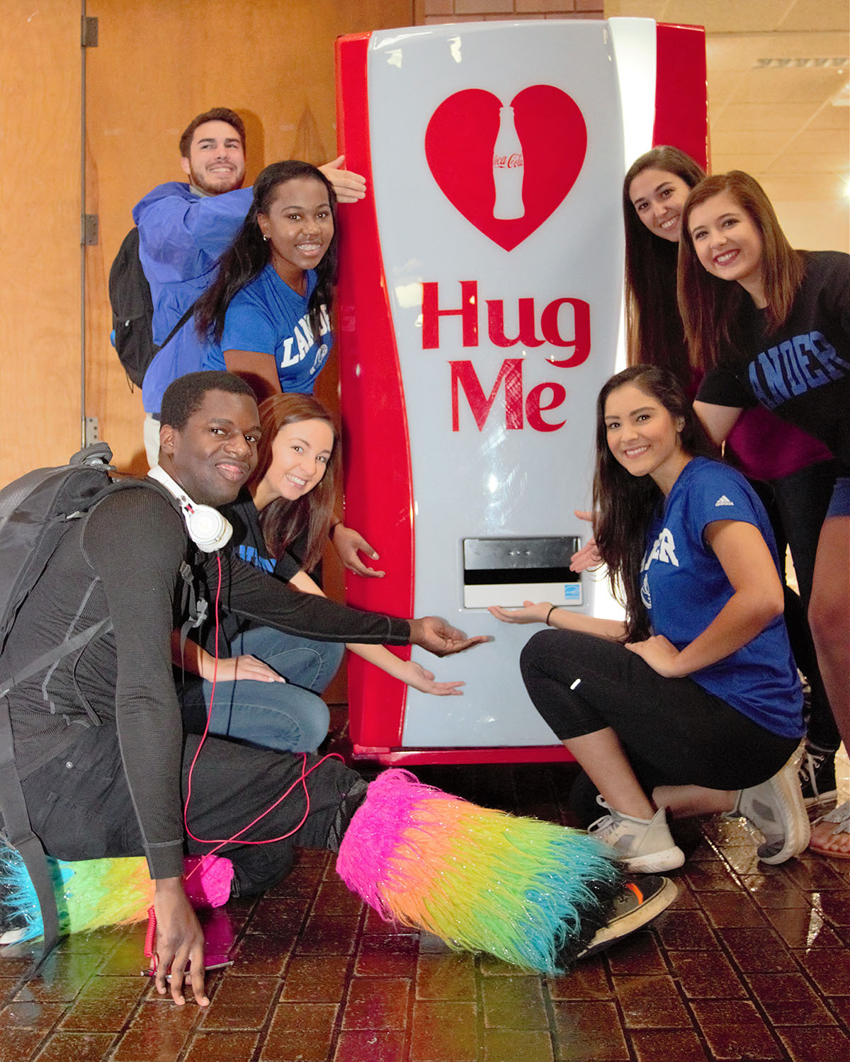Vending machine gives out free drinks for a hug
